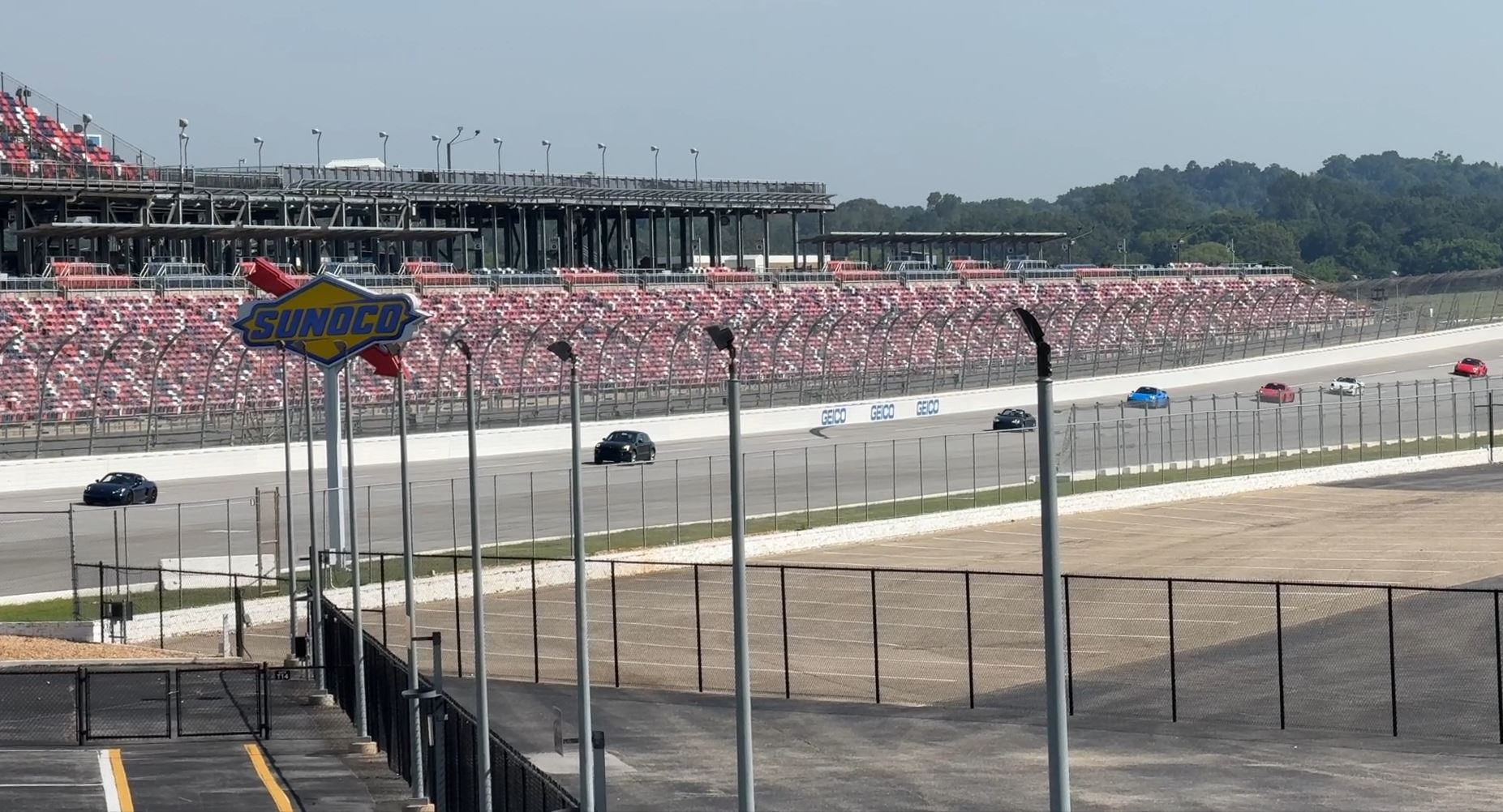 Mark in front of the Talladega sign in his black with yellow stripes ...